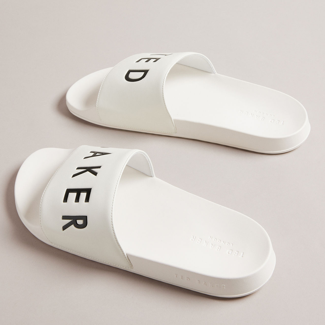 TED BAKER Auly Logo Slides